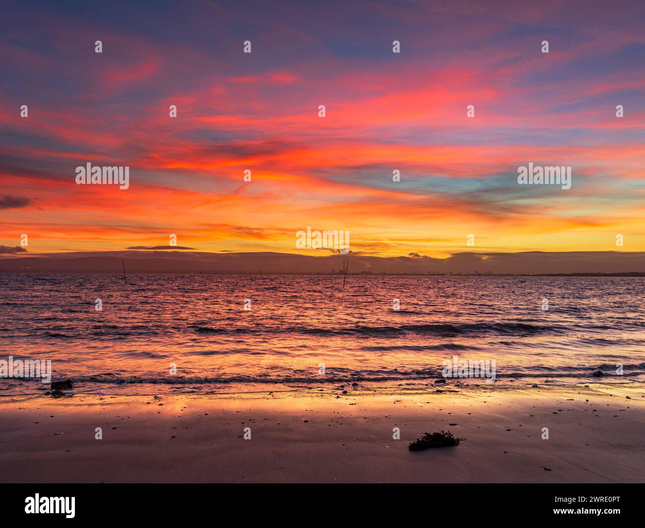 Colourful sunset sky from Sutton Strand facing west Stock Photo - Alamy