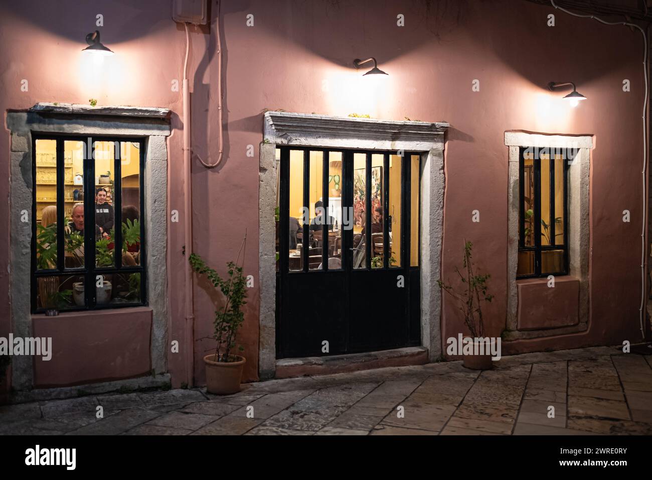 Street city night lights in restaurants. Dining out in greece ...