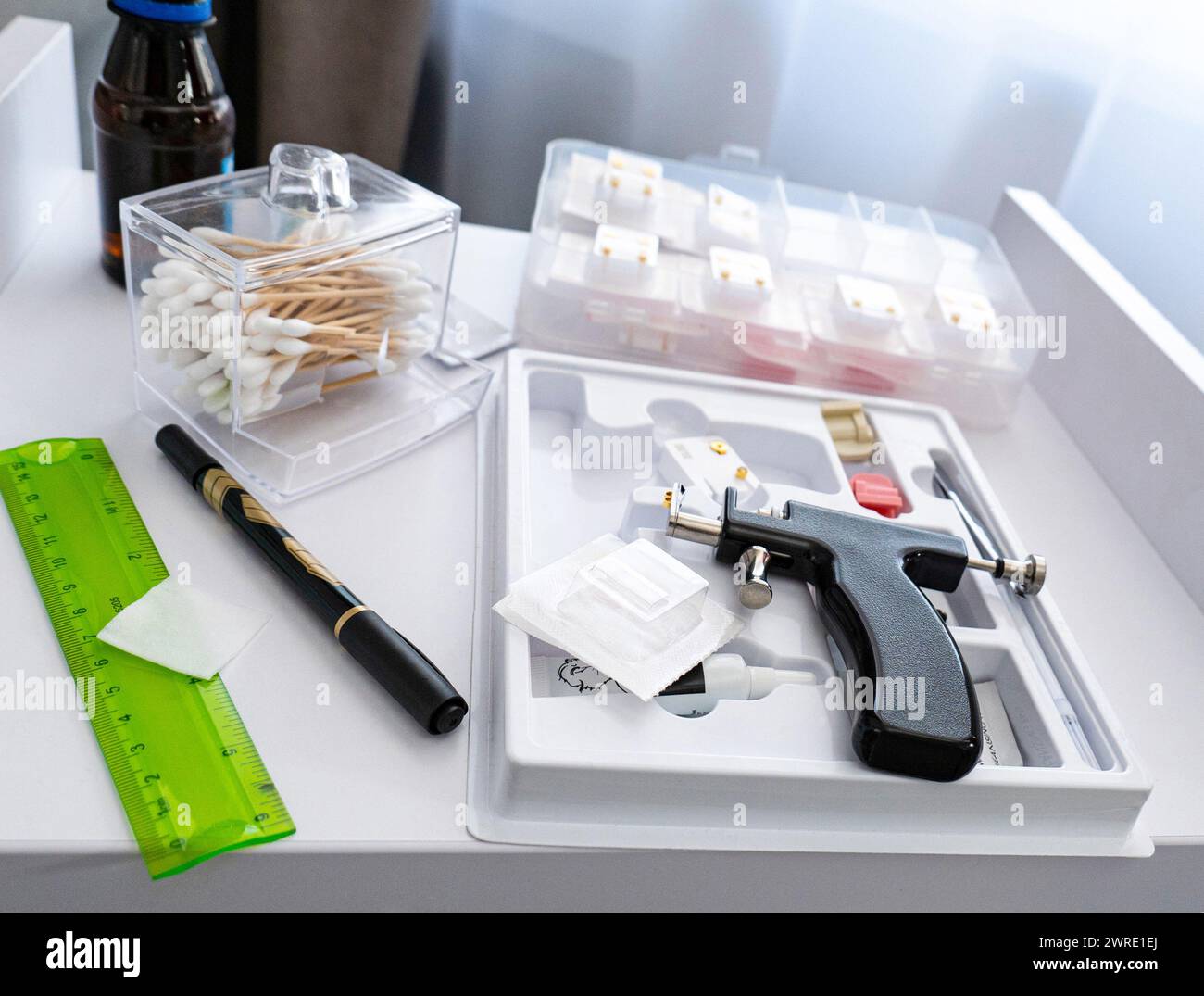 The table with the sterile instruments of the cosmetologist who is ...