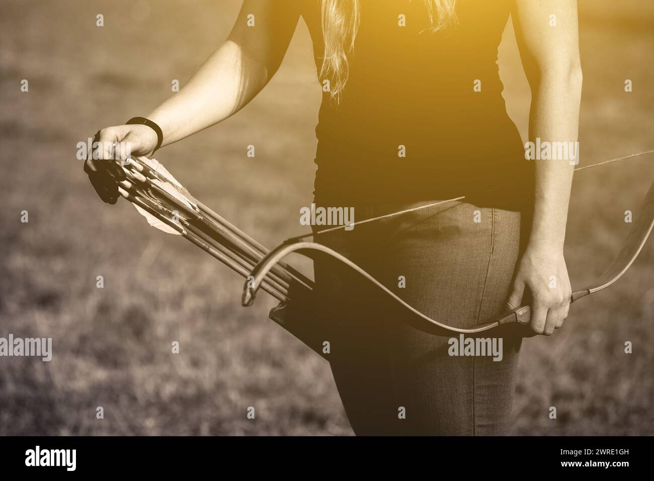 Young man aiming bow arrow hi-res stock photography and images - Alamy