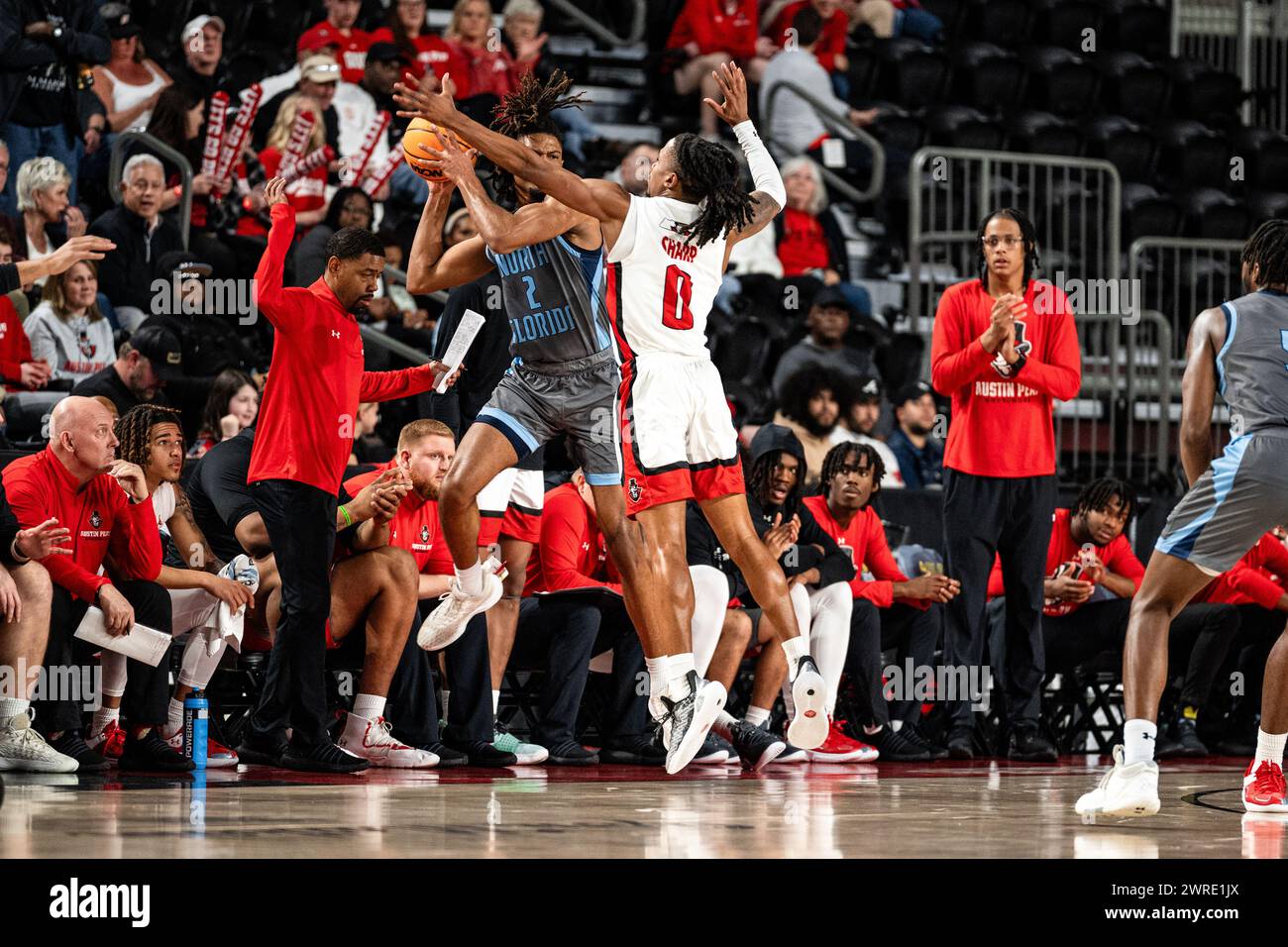 Basketball player leaping to catch ball with hands Stock Photo - Alamy