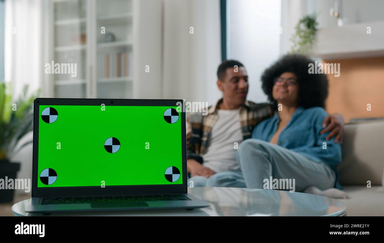 African American couple man woman hug relax at home couch girlfriend ...