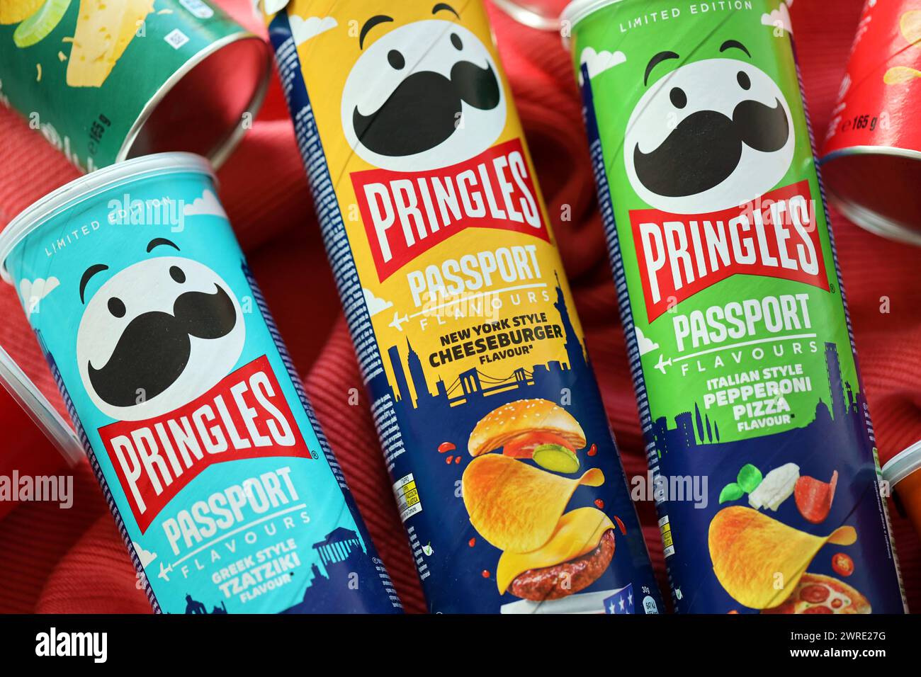 KYIV, UKRAINE - JULY 7, 2023 Pringles passport edition chips cans with ...