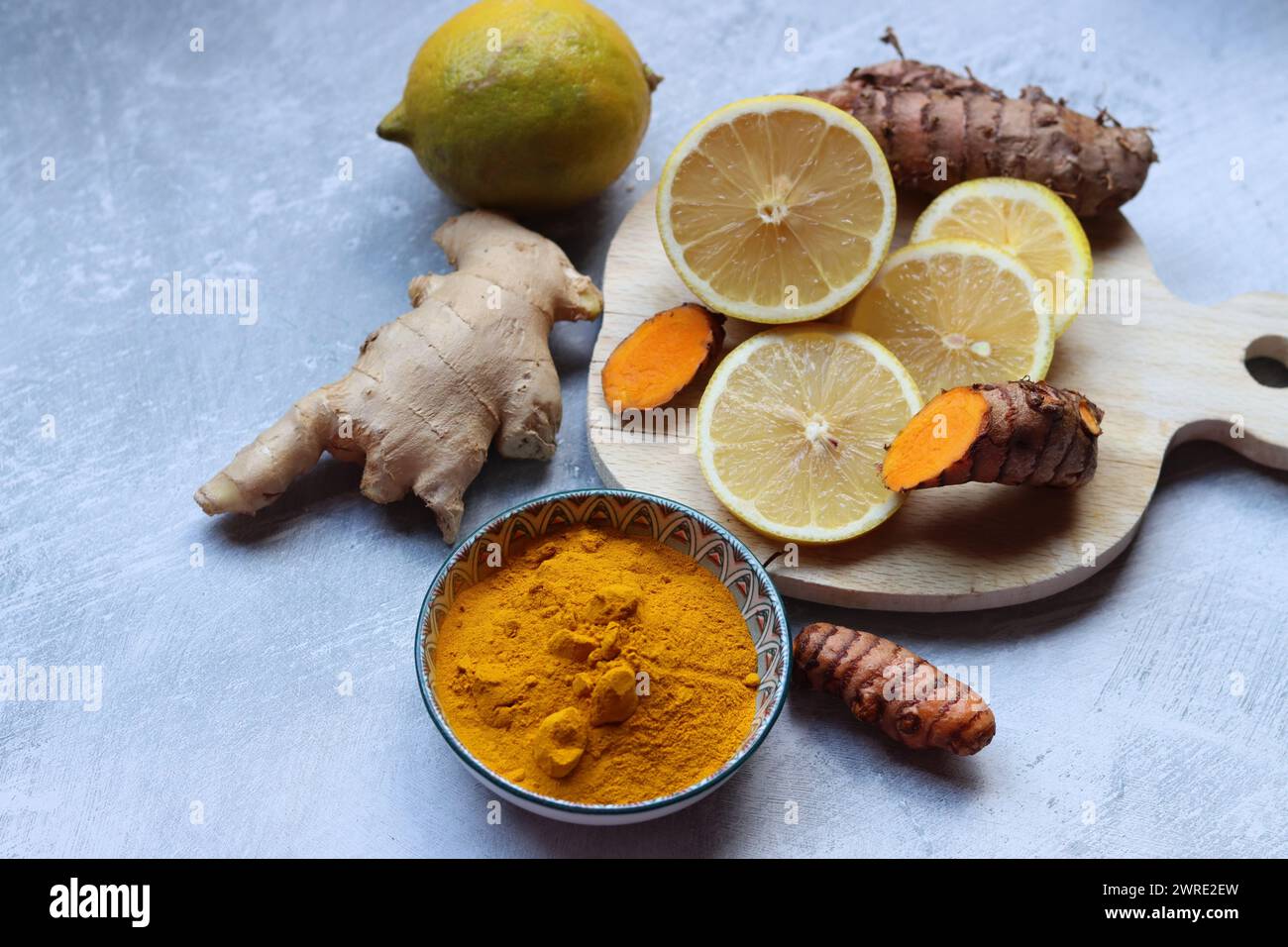 Still life with ginger, turmeric and lemon. Healthy food close up. Cold ...