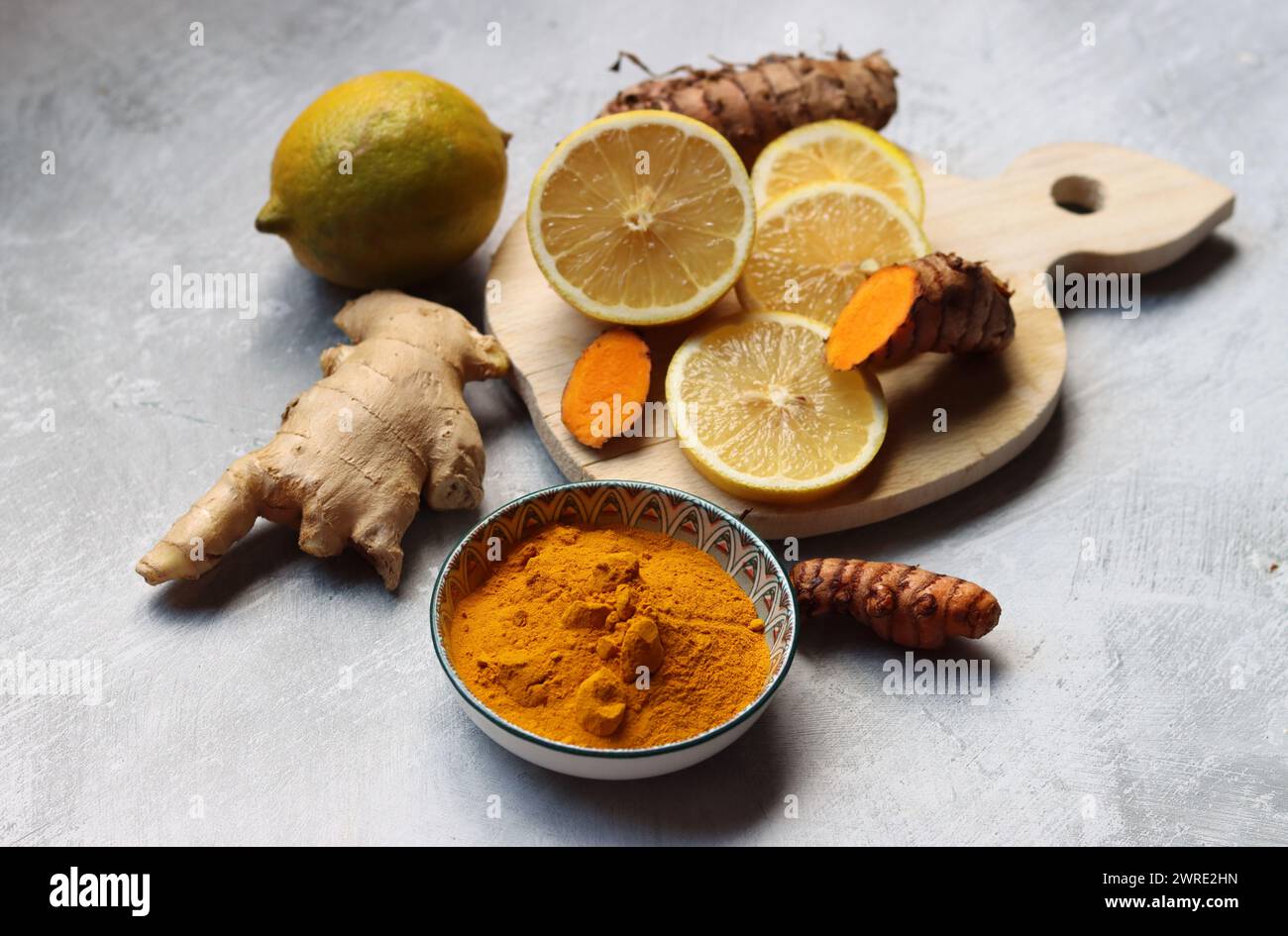 Still life with ginger, turmeric and lemon. Healthy food close up. Cold ...