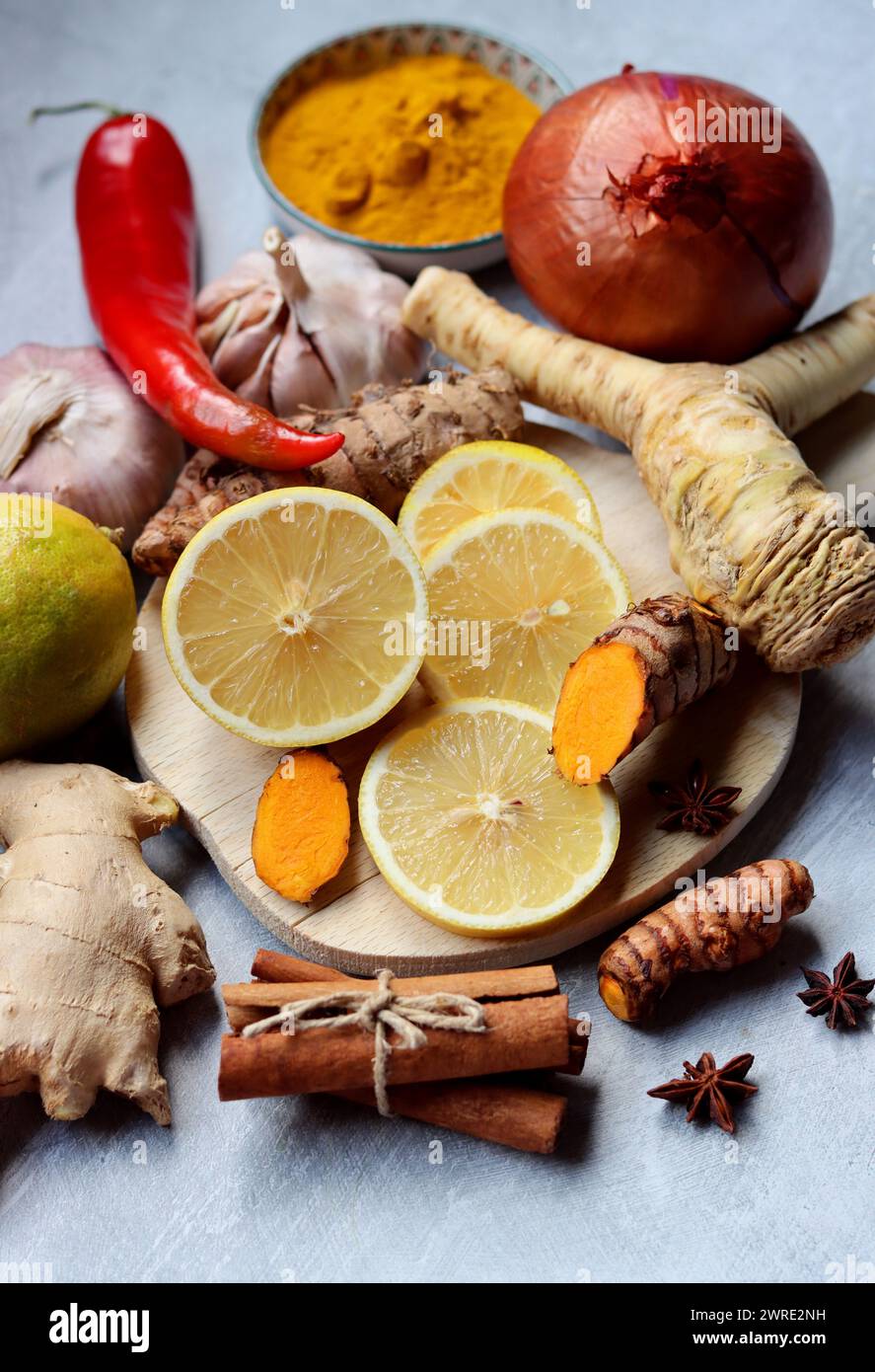Still life with ginger, turmeric and lemon. Healthy food close up. Cold ...