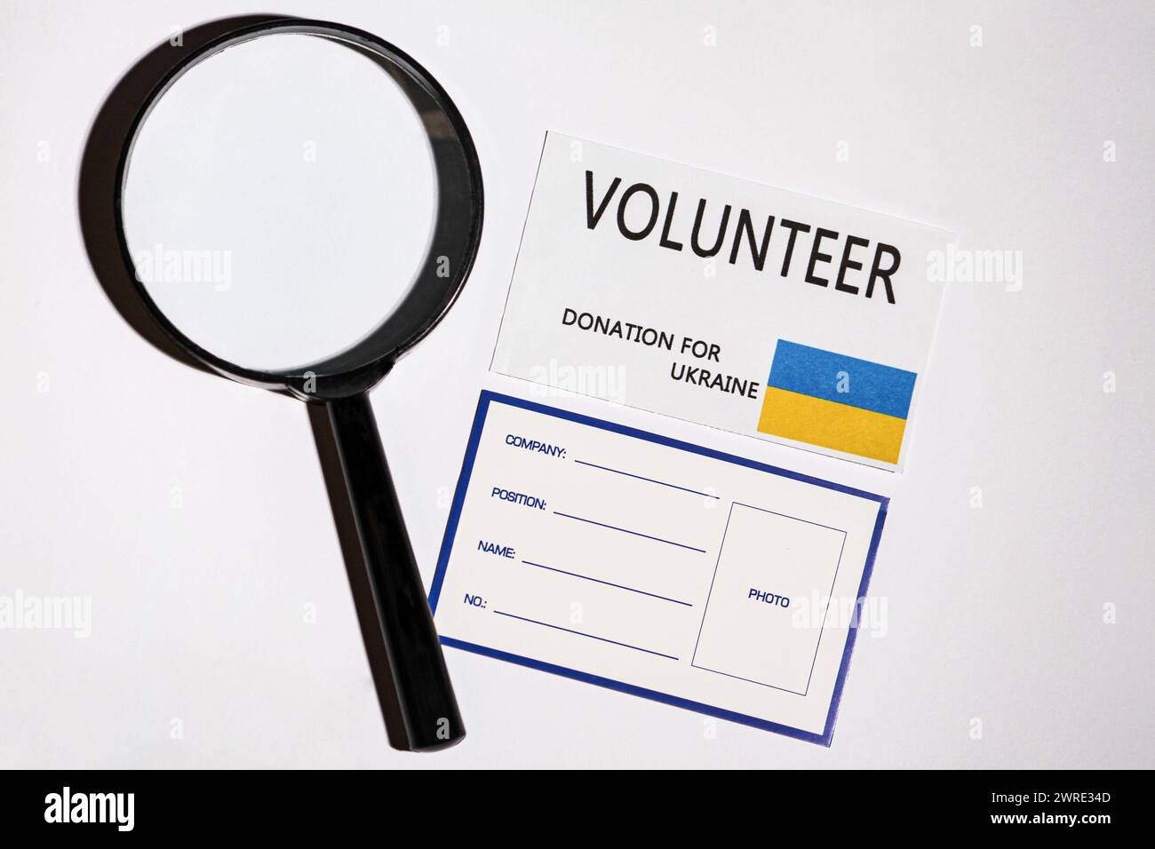 Picture on a white background with a magnifying glass and two ...