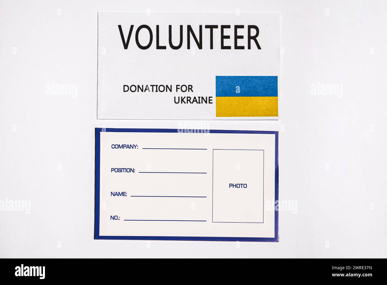 Picture on a white background with 2 accreditation cards for ...