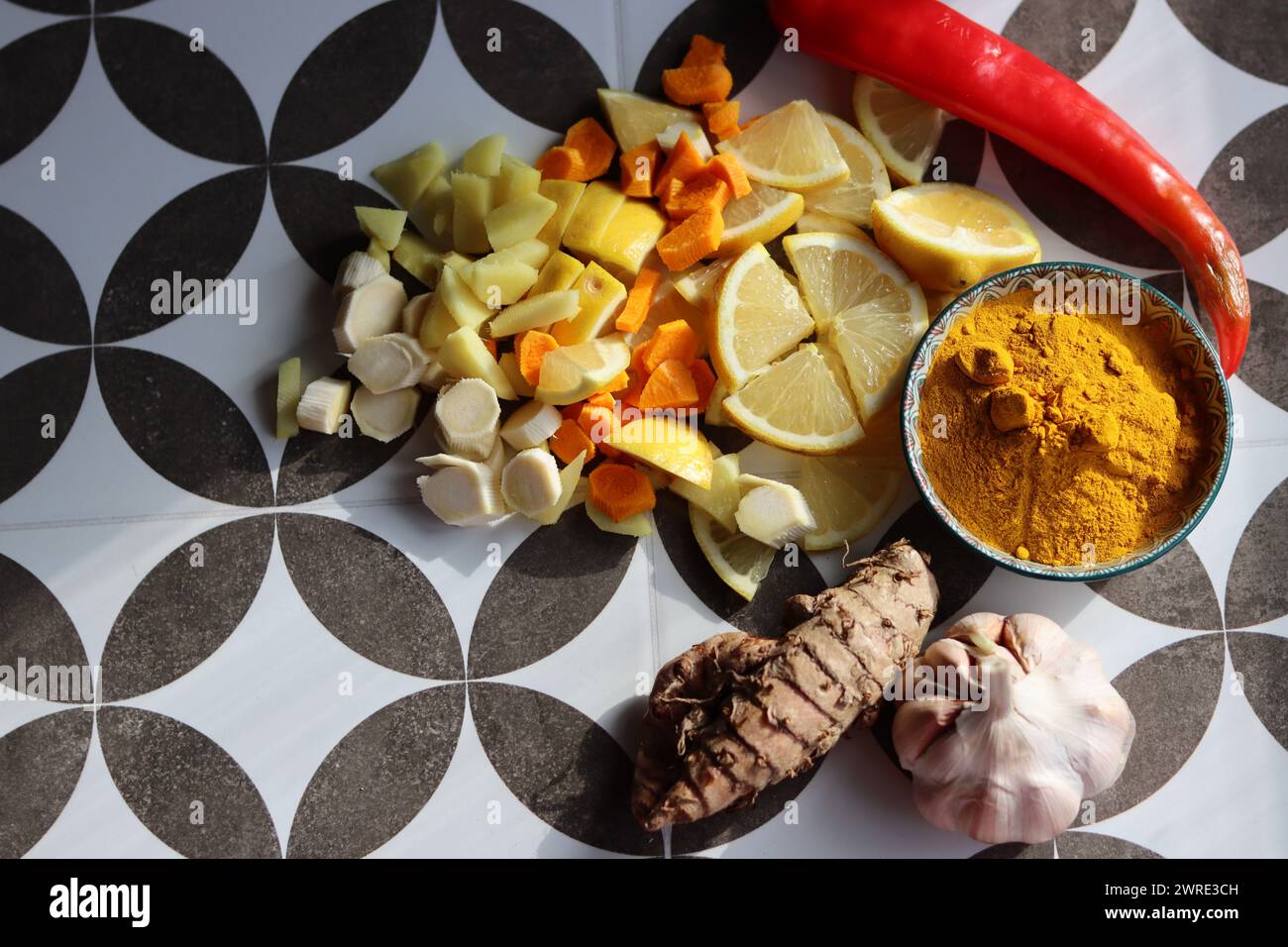 Fire cider chopped ingredients on grey tiled background. Top view photo ...