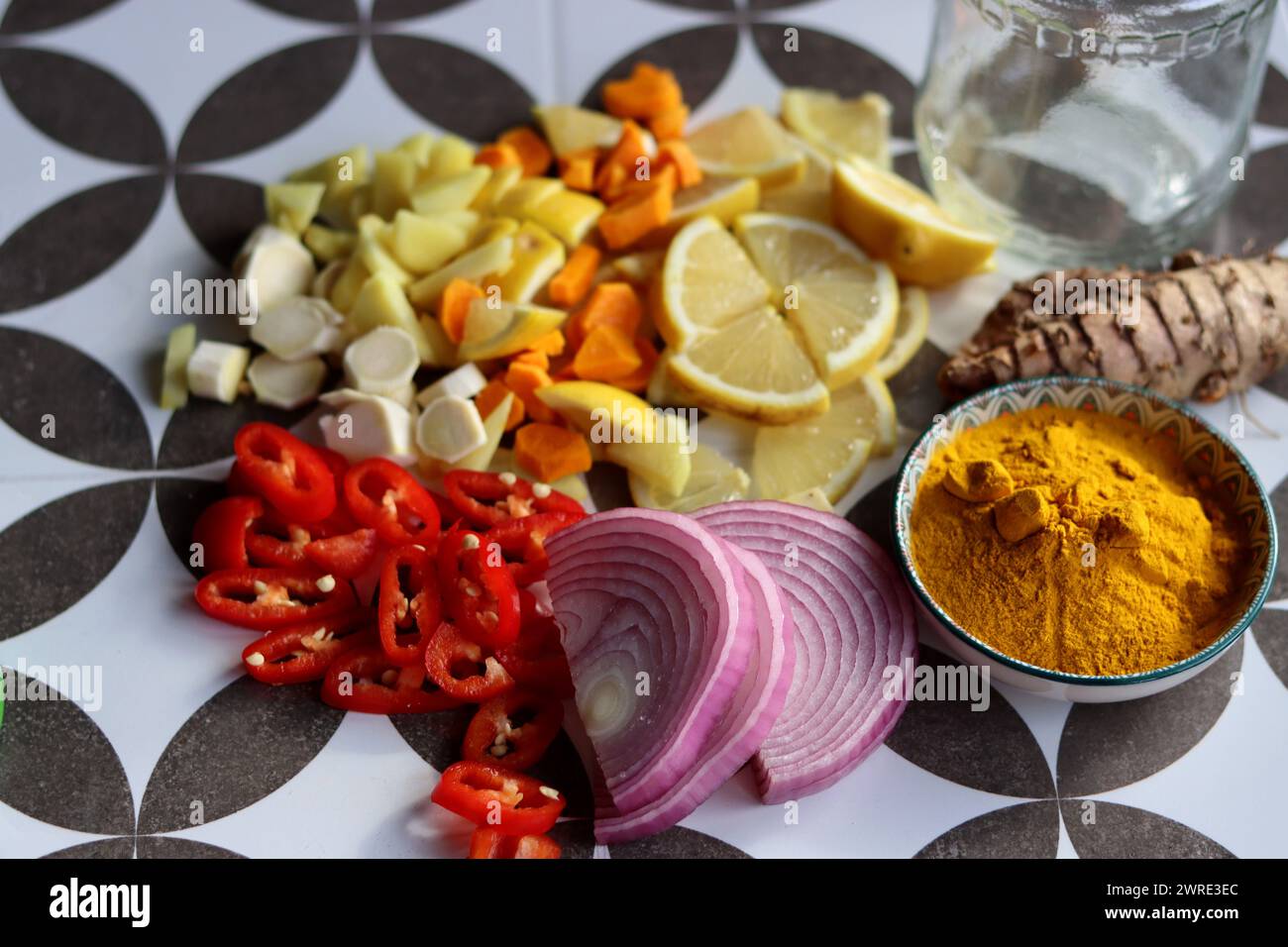 Fire cider chopped ingredients on grey tiled background. Top view photo ...