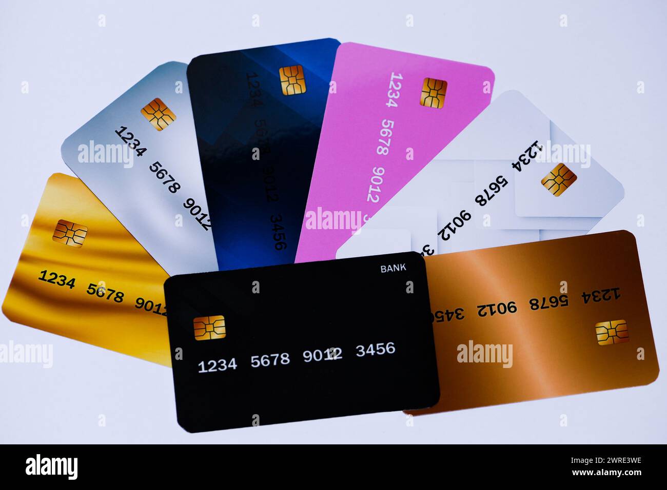 Picture on a gray background with bank cards of different colors that ...