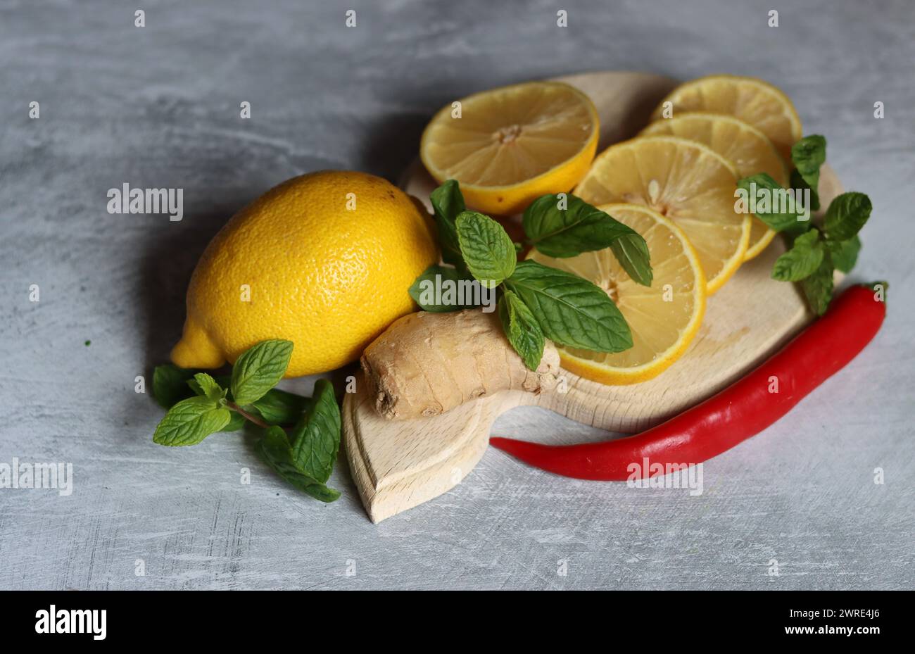 Lemons and mint leaves. Still life with organic fruit. Eating healthy ...