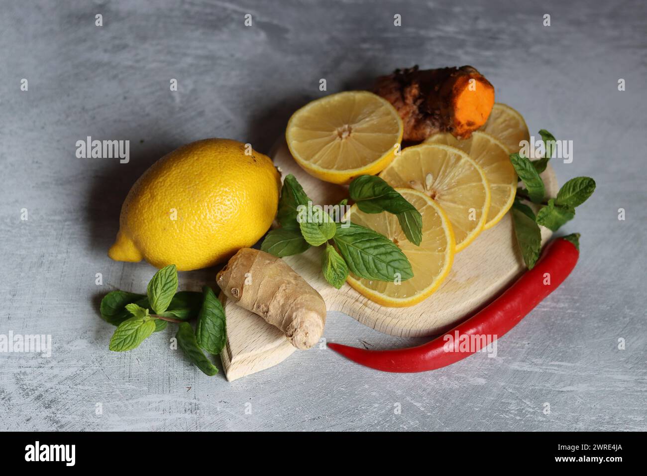 Lemons and mint leaves. Still life with organic fruit. Eating healthy ...