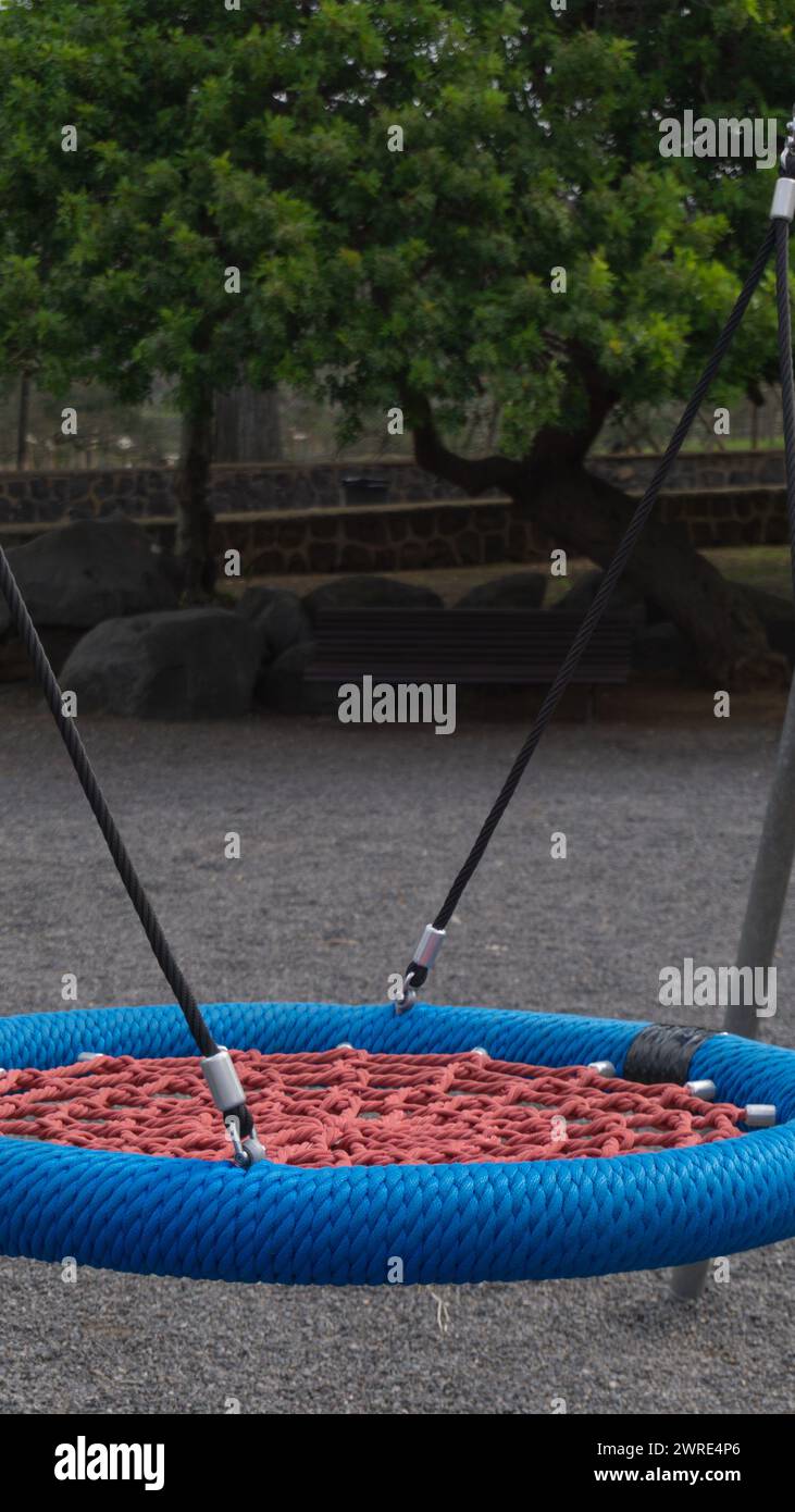 Vibrant swing set, leisurely park scene Stock Photo - Alamy