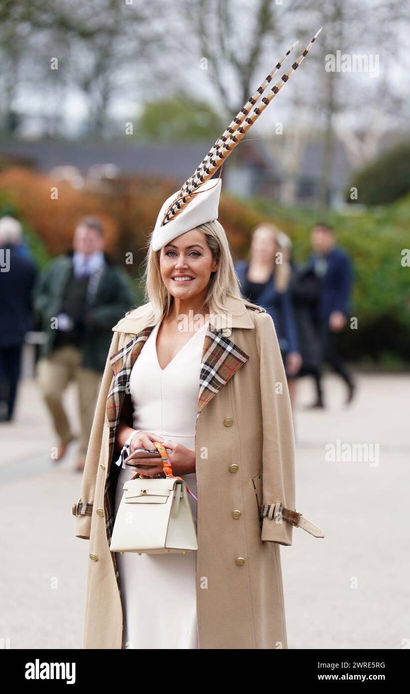 A racegoer arriving on day one of the 2024 Cheltenham Festival at ...