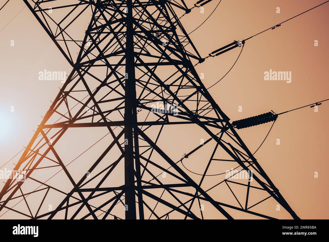 High voltage power grid towers with sky background. Electrical power ...