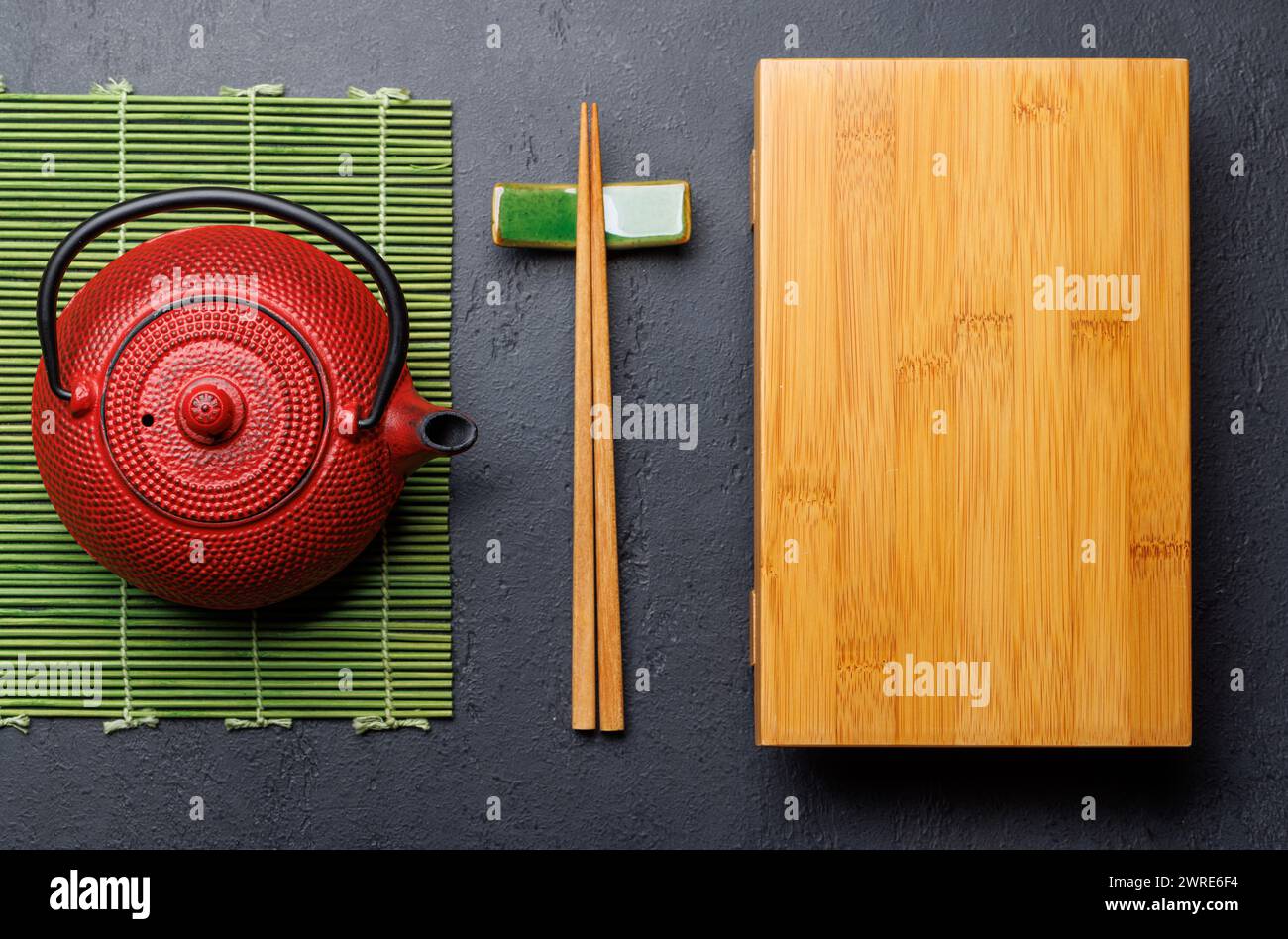 Japanese Table Setting with Wooden Board, Teapot, Chopsticks, and Copy ...