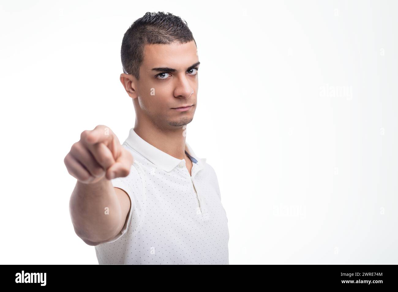 With a focused expression, he points forward, conveying a sense of ...