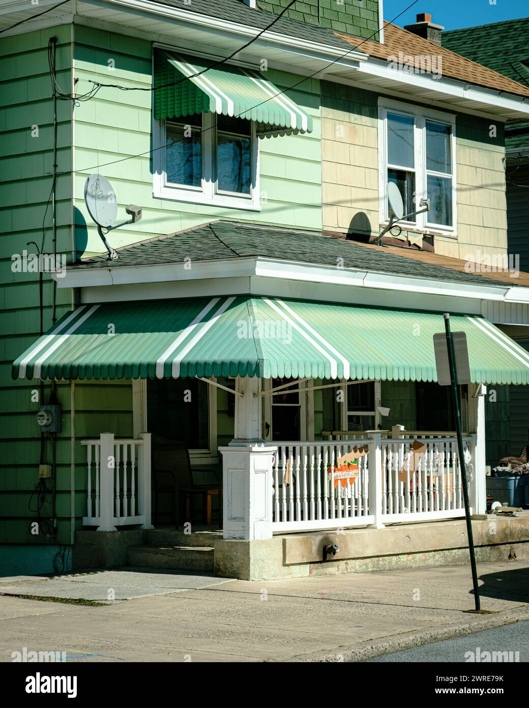 Green house with awnings in Tremont, Pennsylvania Stock Photo - Alamy