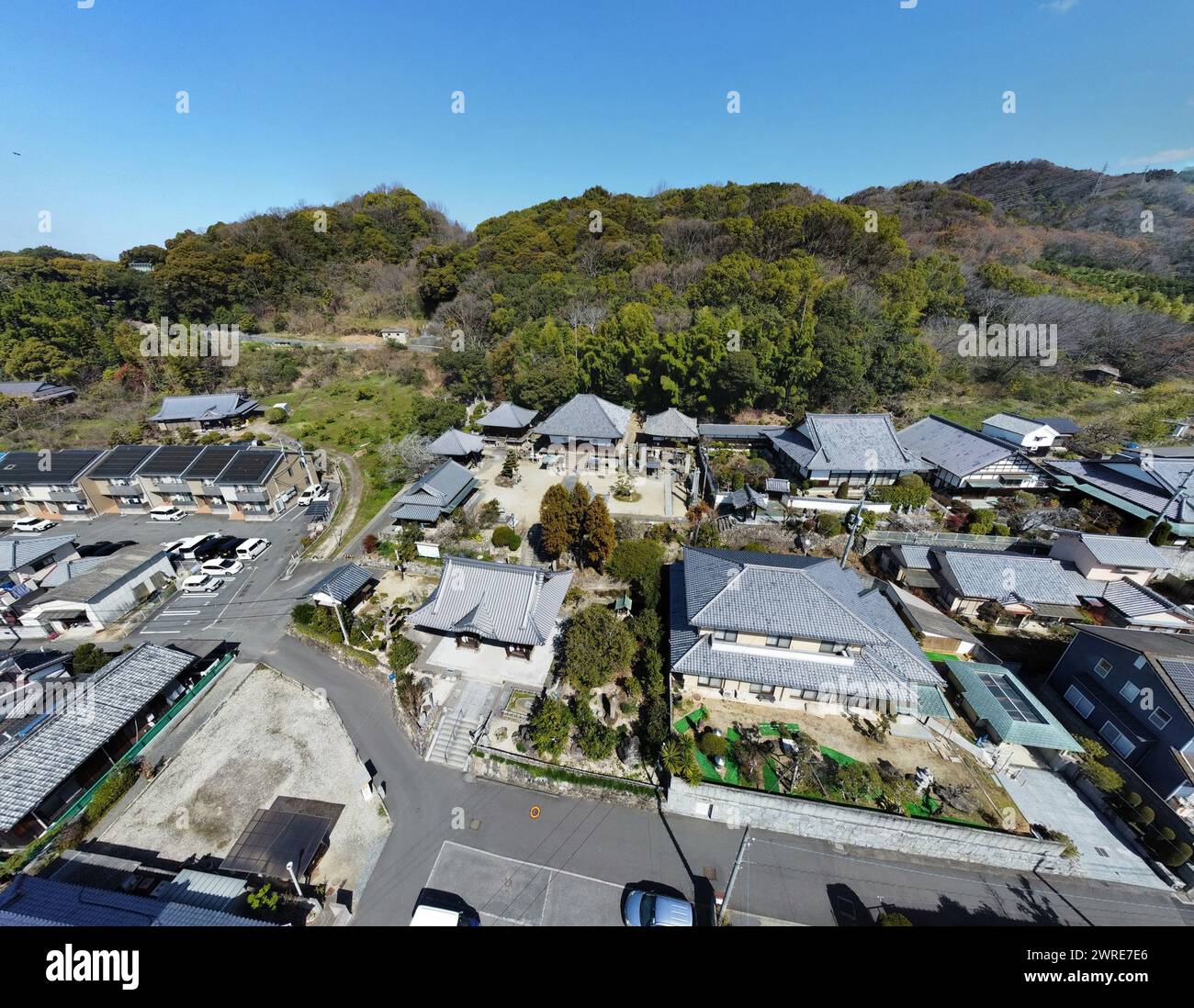 Aerial view of temples nestled near mountains in Matsuyama City Stock ... Aerial view of temples nestled near mountains in Matsuyama City Stock ...