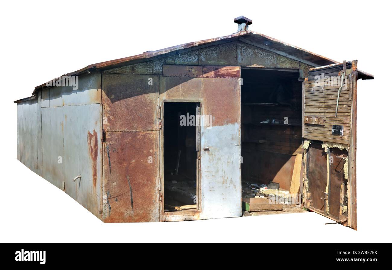 Old destroyed metal garage with open door. Isolated on white Stock ...