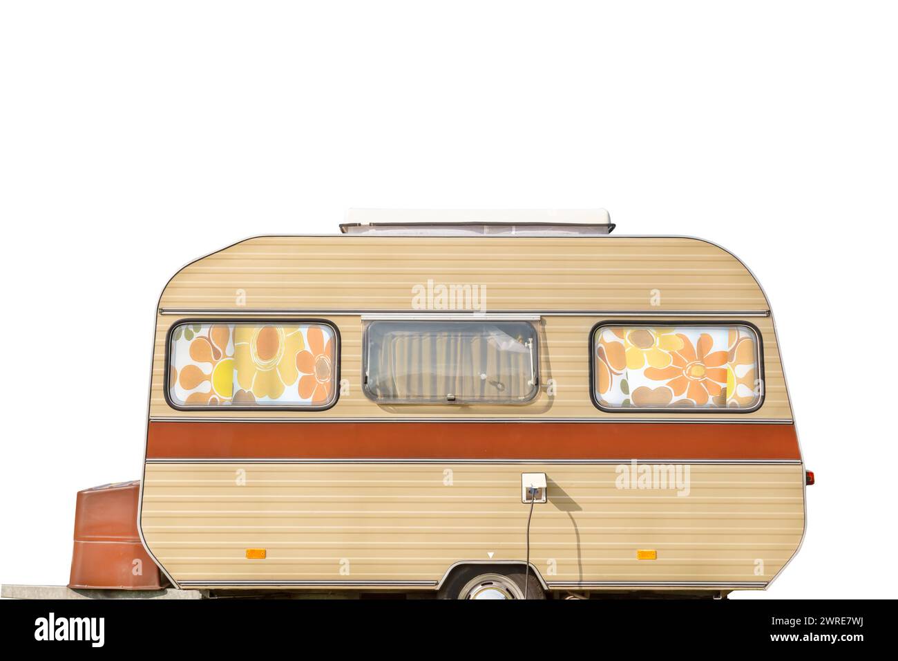 Seventies retro caravan in brown colors with flower curtains isolated ...