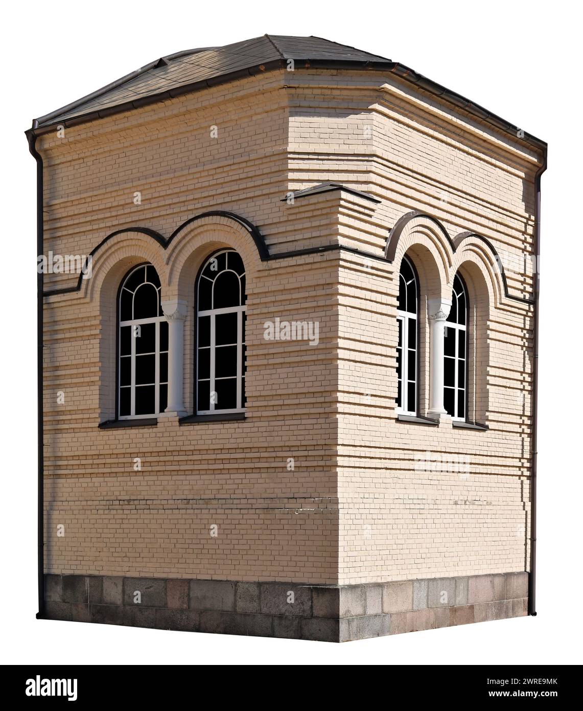 Small yellow brick barn with arched windows. Isolated on white Stock ...