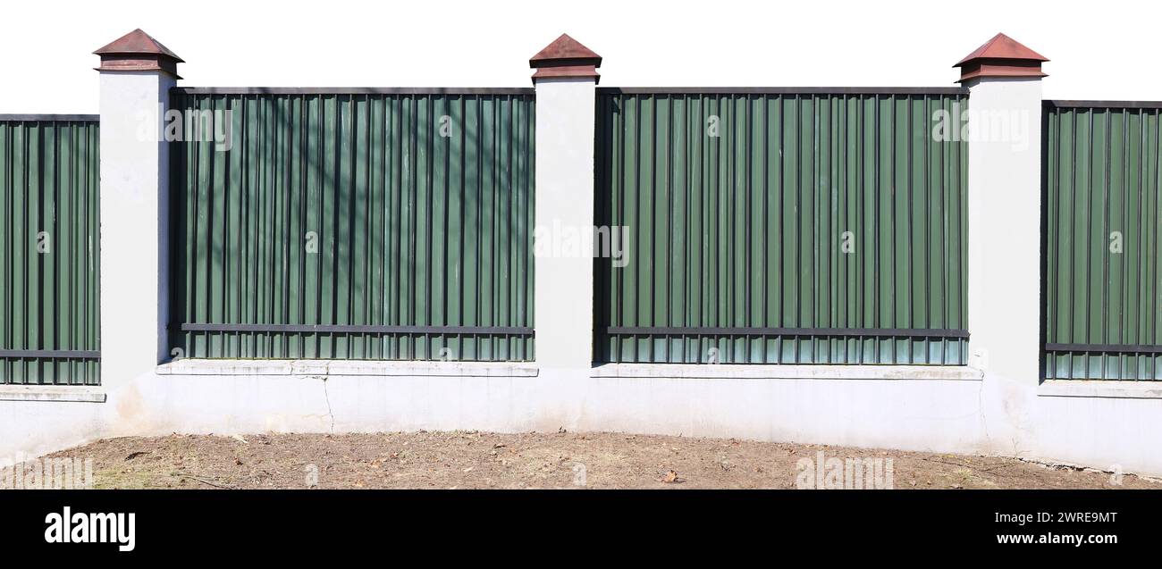 Solid fence made of steel bars, iron sheets and concrete. Isolated on ...