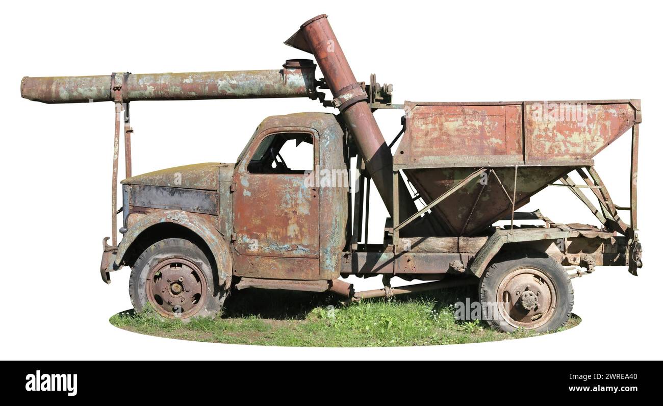 Vintage broken rusty agricultural machinery - straw loader. Isolated on ...