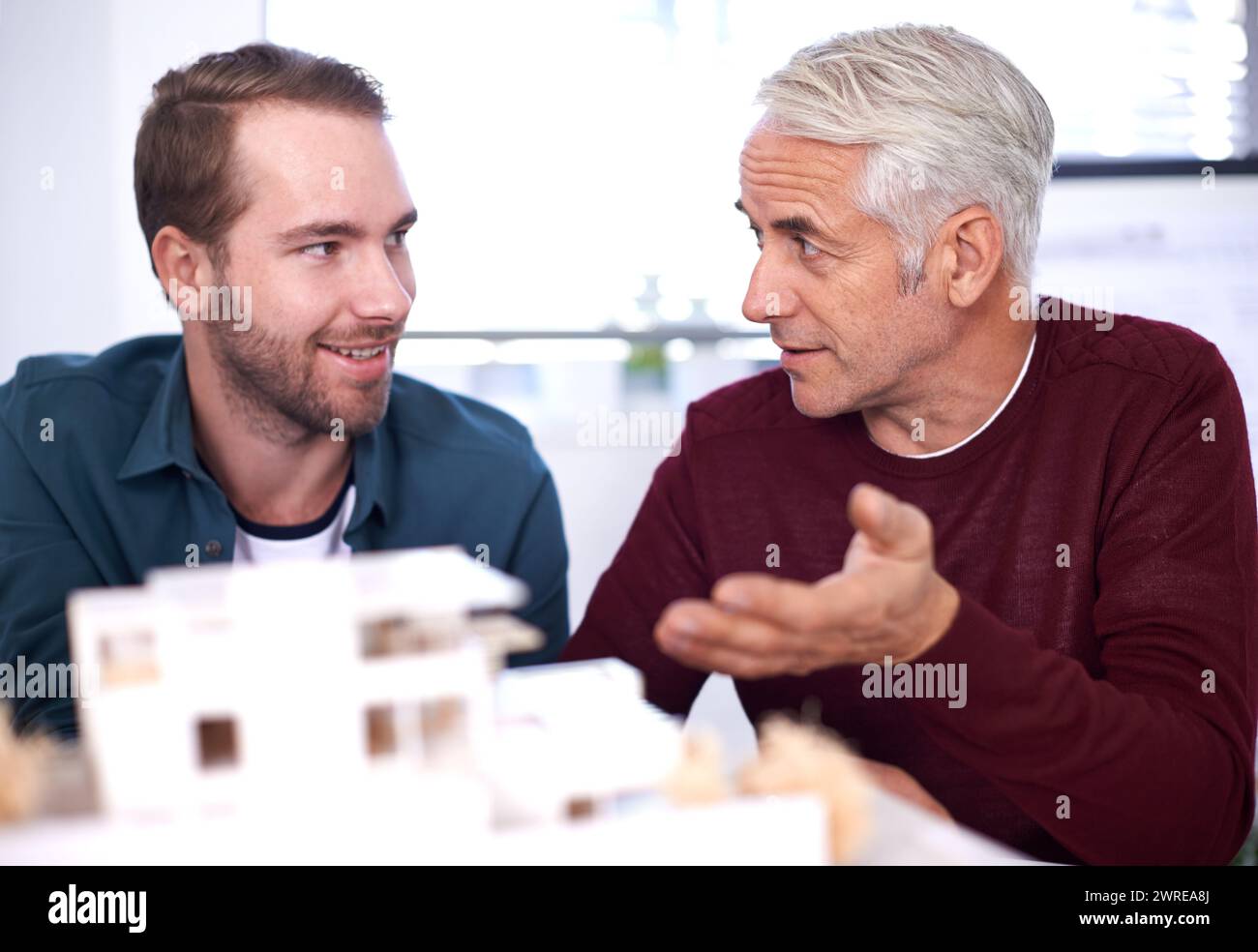 Building model, men and business people with architecture, planning and ...