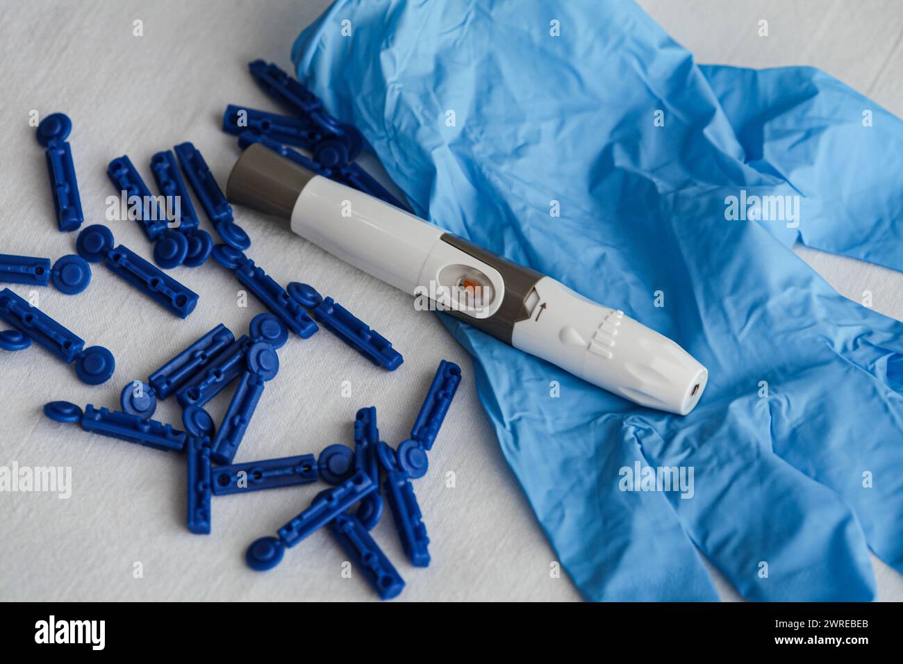 Fingertip blood collection device with adjustable depth needle to check ...