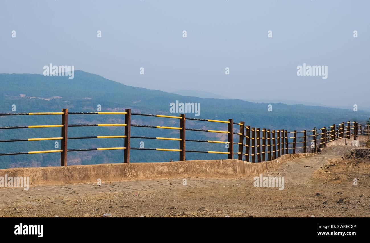 Railings of metal pipe fence or round steel fence around the edge of ...