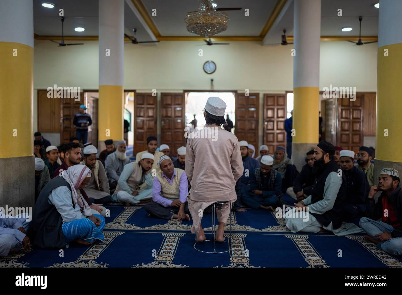 Nepalese Muslims listen to a priest at the Jame Mosque on the first day ...