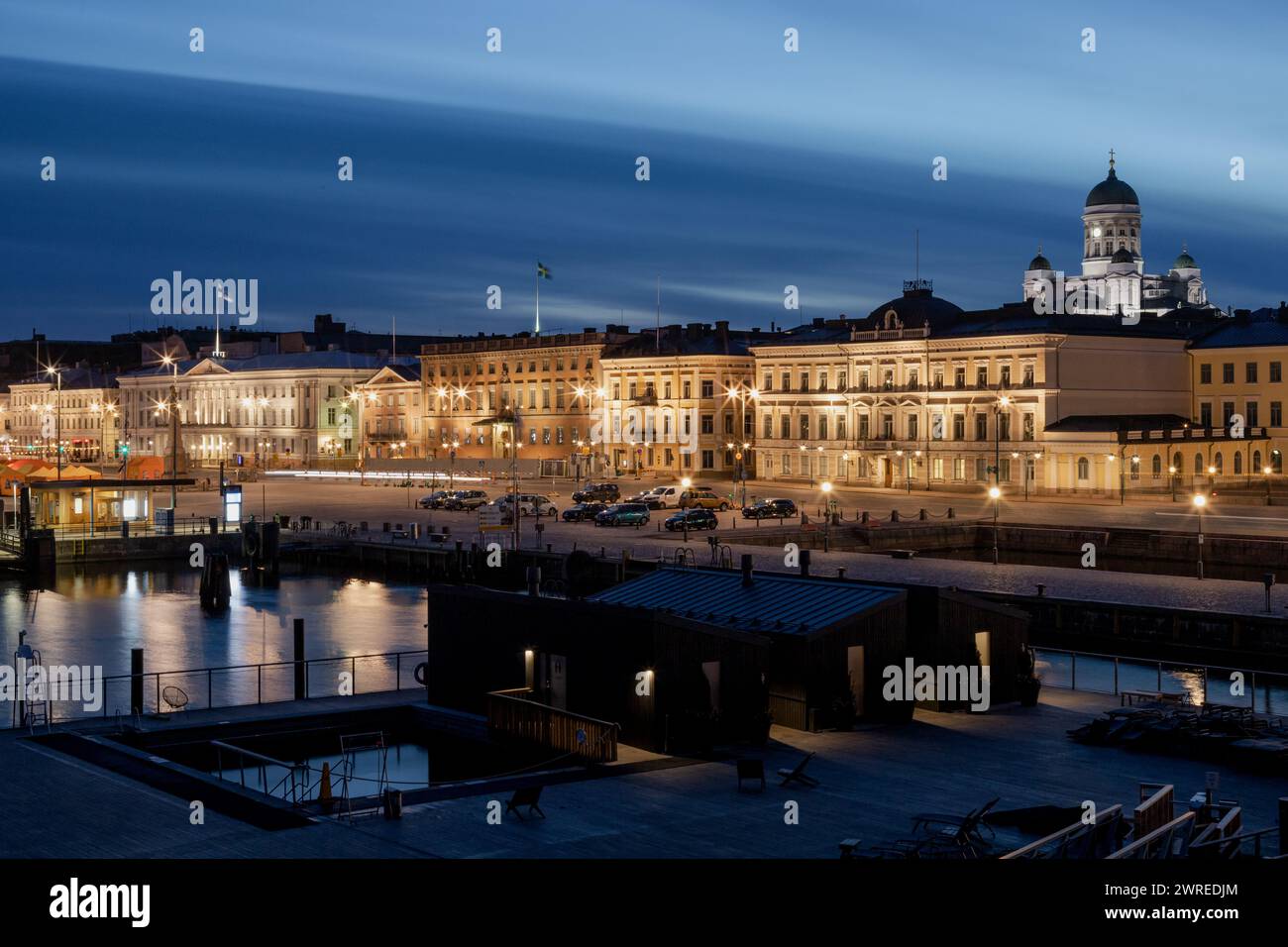Night harbor scene with boats and shoreline buildings Stock Photo - Alamy