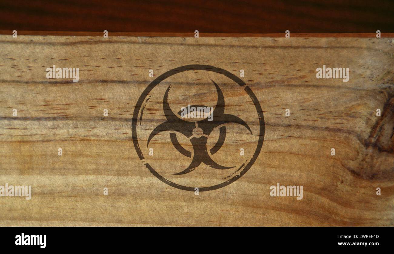 Biohazard warning stamp printed on wooden box. Biological hazard symbol ...