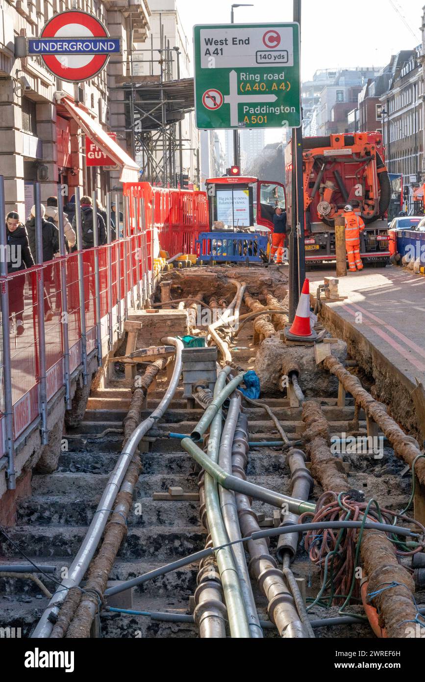 Road works in the West End of London, UK. Fibre fast internet cabling ...