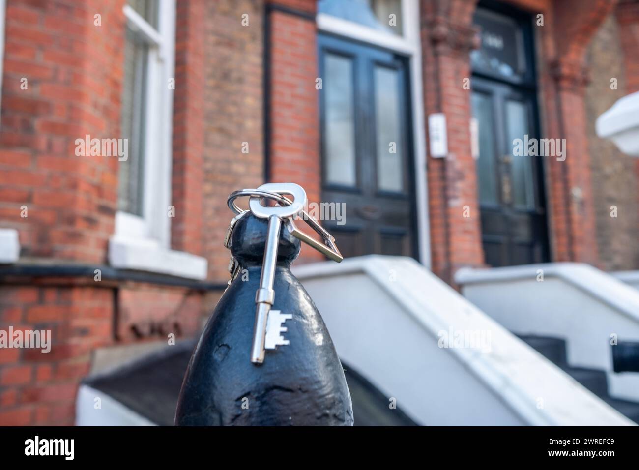 Typical red brick British house with house keys in foreground Stock ...