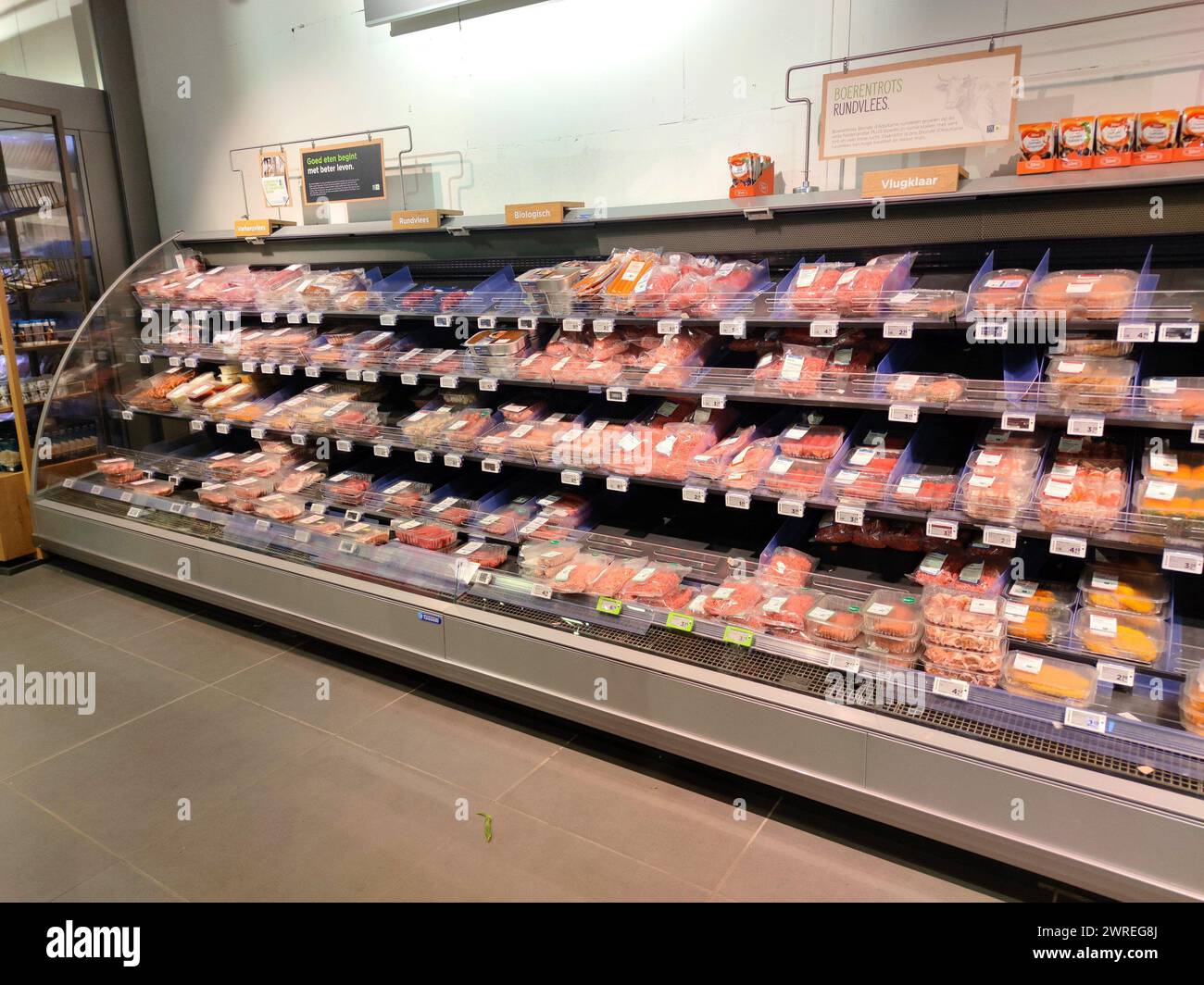 Wares with meat products, butcher's section in a dutch supermarket ...