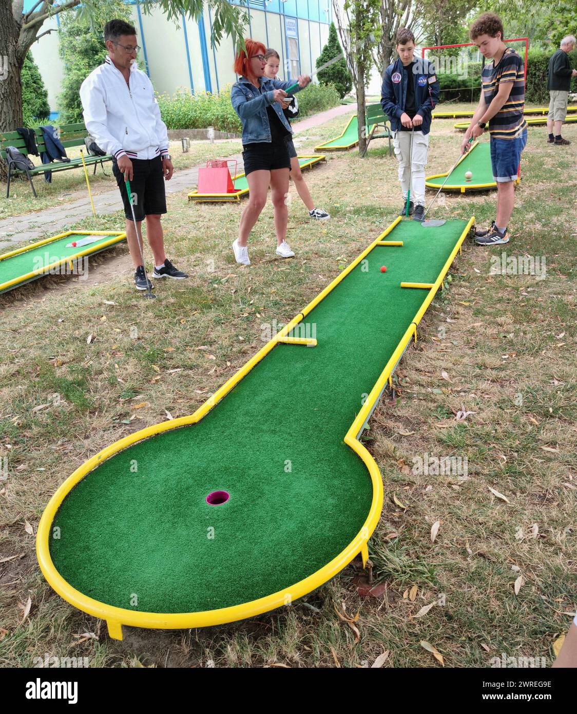 People play a game of miniature golf in a town along Lake Balaton in ...