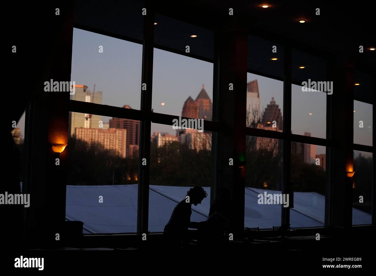 A poll worker waits for voters at a polling site for the Presidential ...