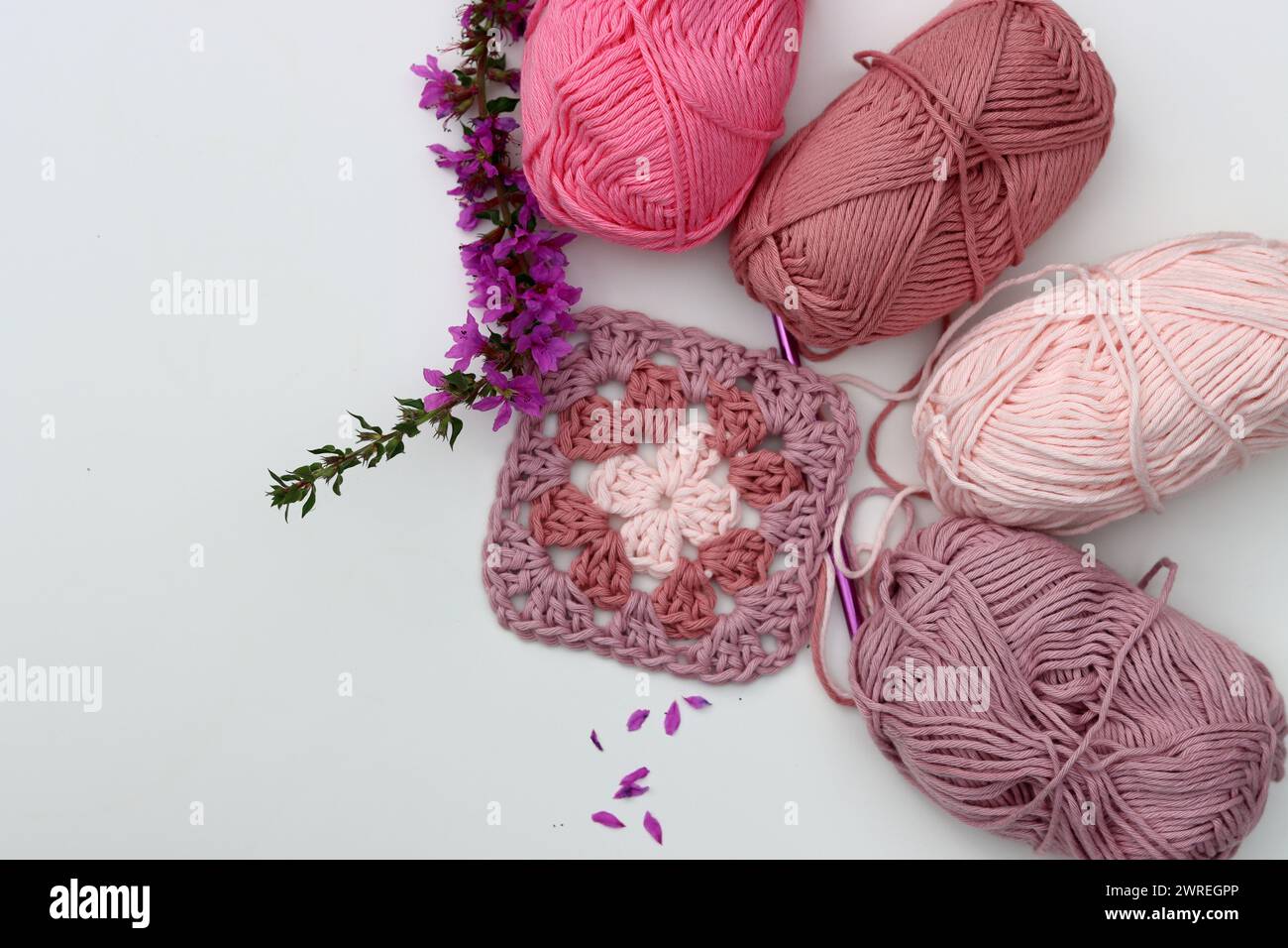 Crochet pattern, flowers, cotton yarn balls top view photo. Granny ...