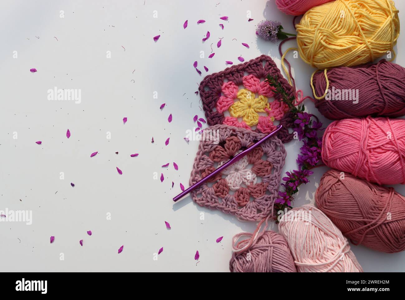 Crochet pattern, flowers, cotton yarn balls top view photo. Granny ...