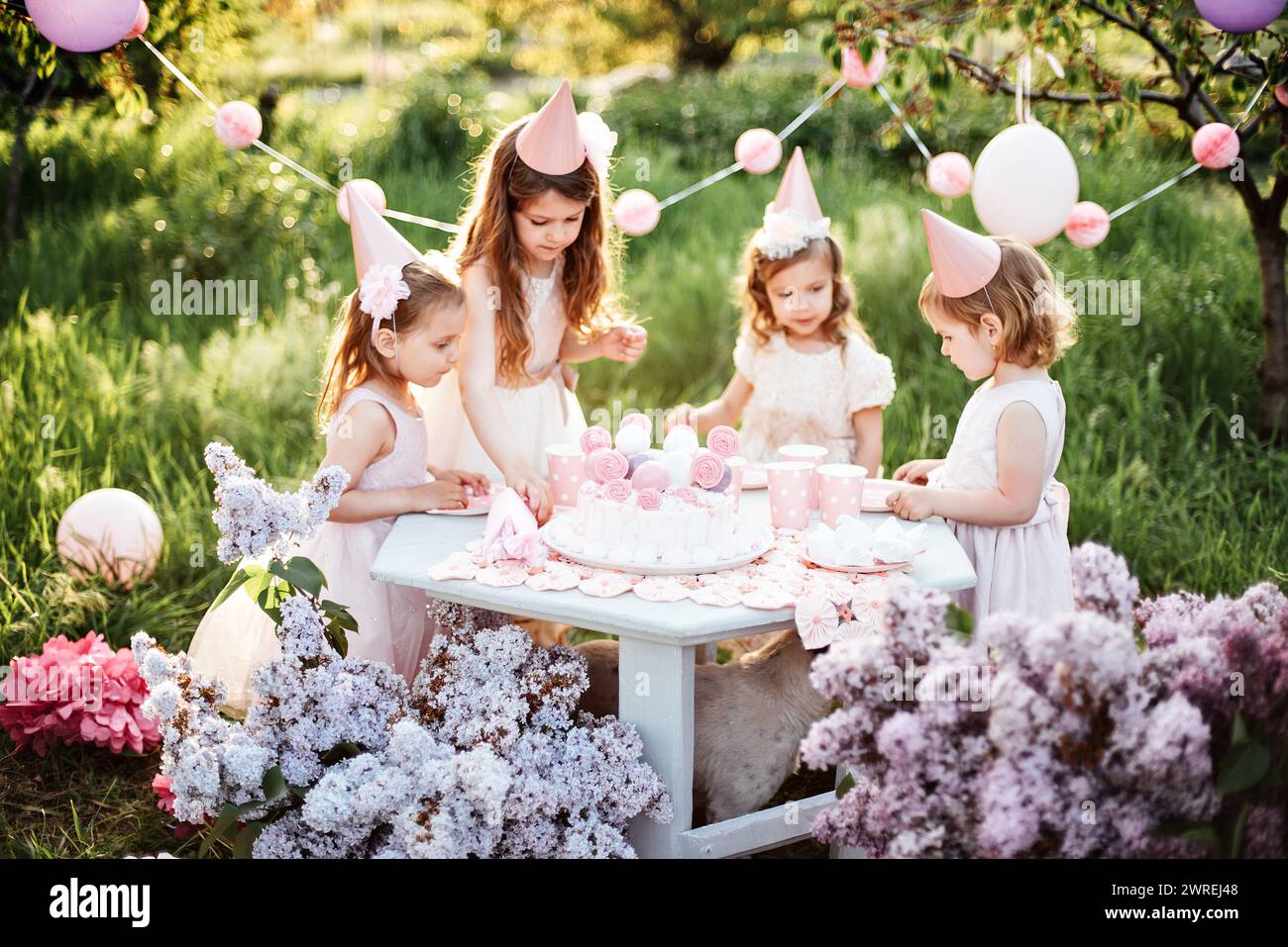 Summer outdoor kids birthday party. Group of happy Children celebrating ...