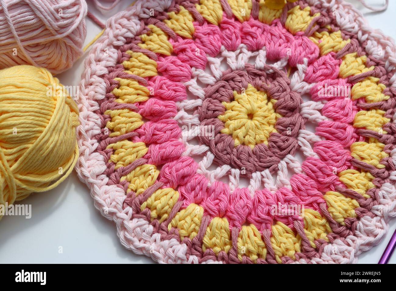 Pink crocheting. Handmade ornament made of organic pink yarn. White ...