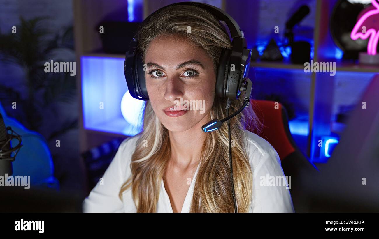 Fierce face off, young, attractive blonde streamer seriously engrossed ...