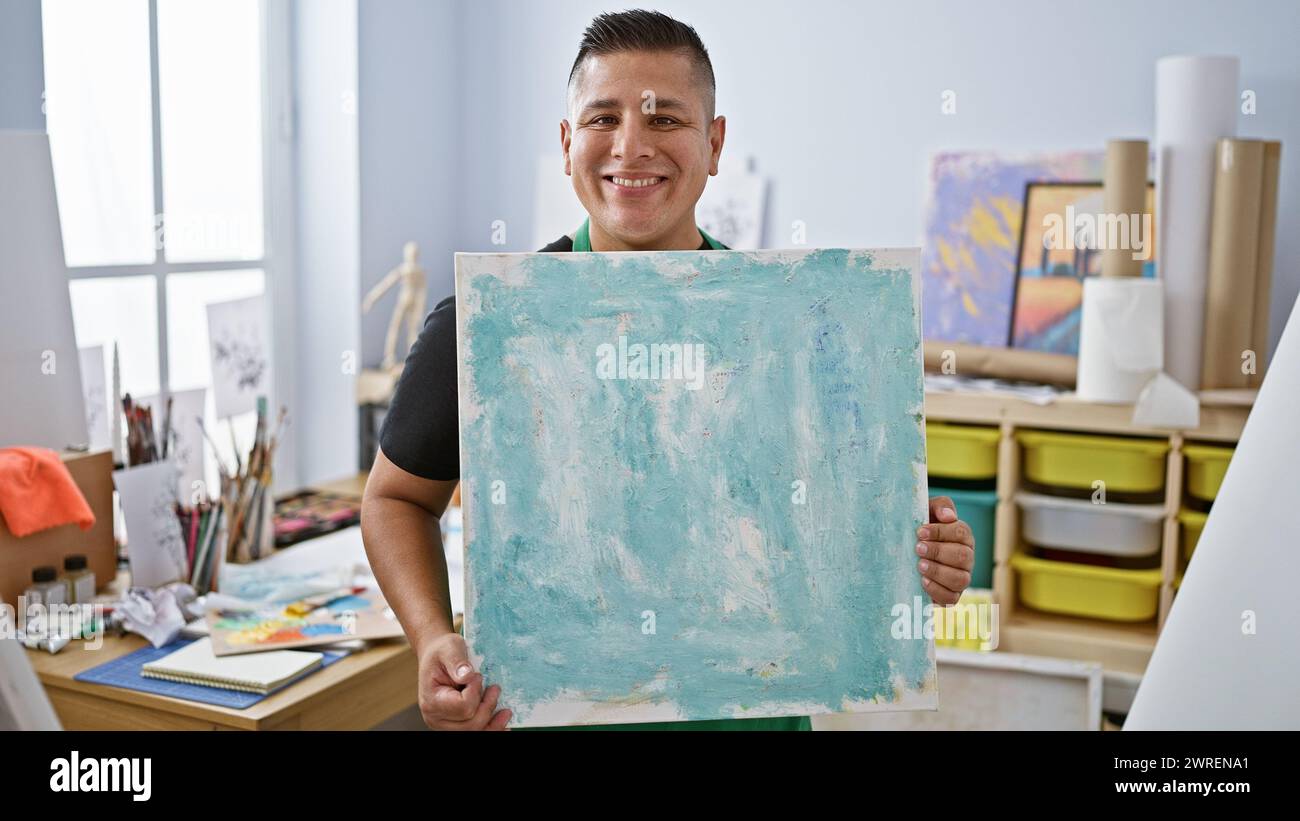 Young smiling painter showing paint hi-res stock photography and images ...