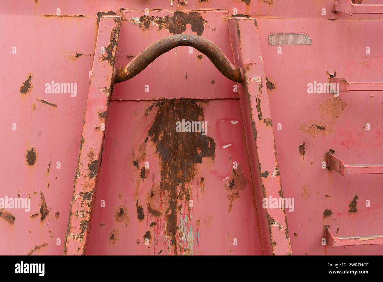 Red used rusty container for collecting recycling material. Front view ...
