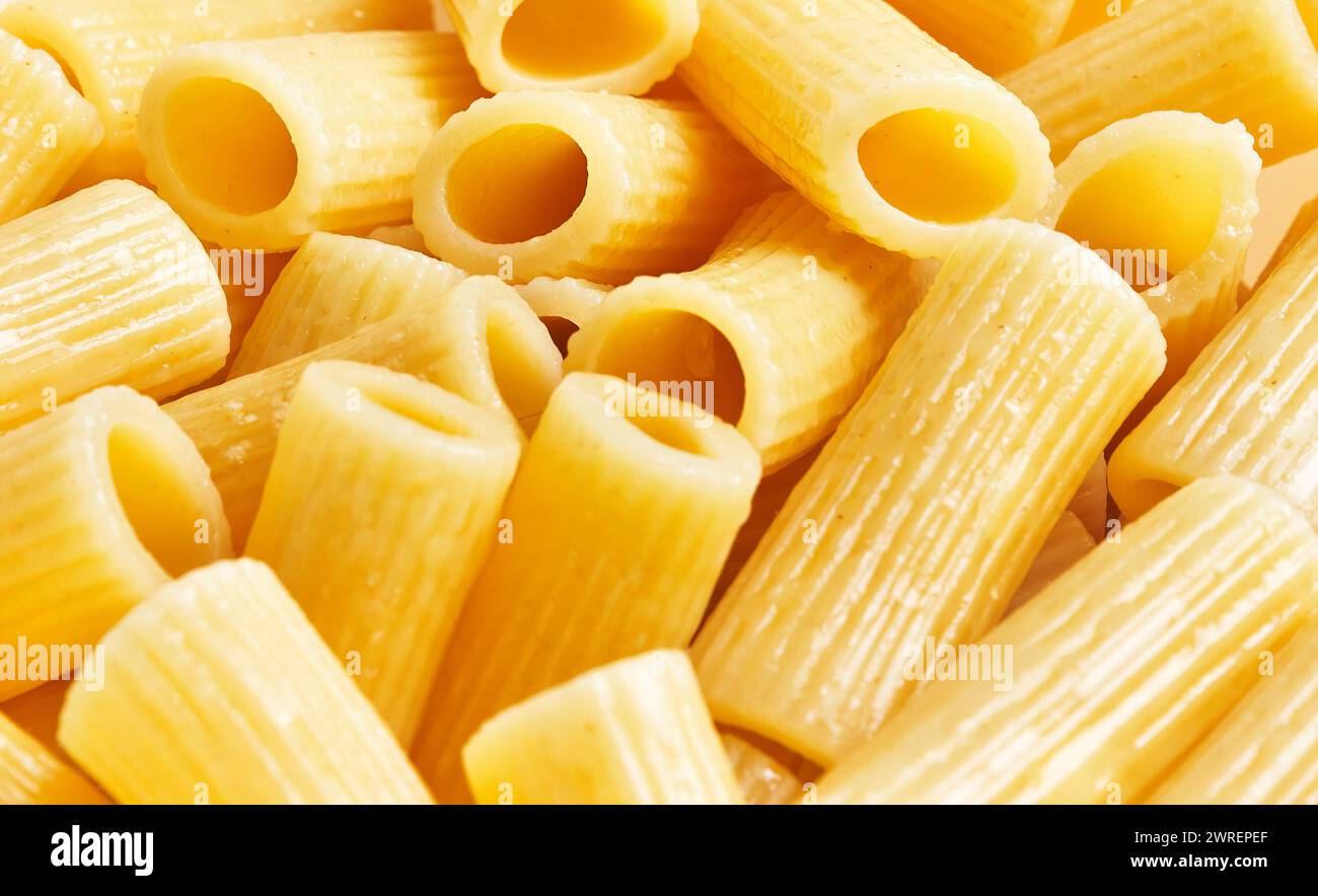 Tubular pasta penne in boiling hi-res stock photography and images - Alamy