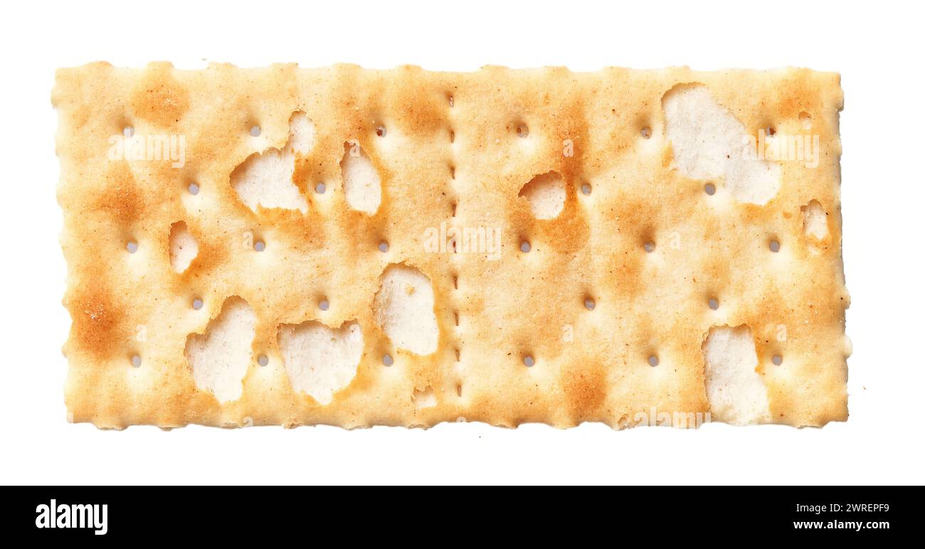 A single, crisp rectangular saltine cracker isolated on a white ...