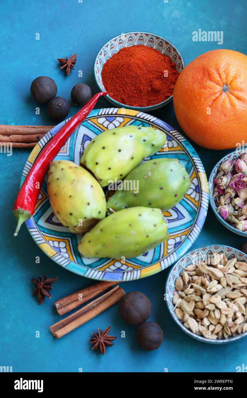 Still life with different spices on blue background with copy space ...